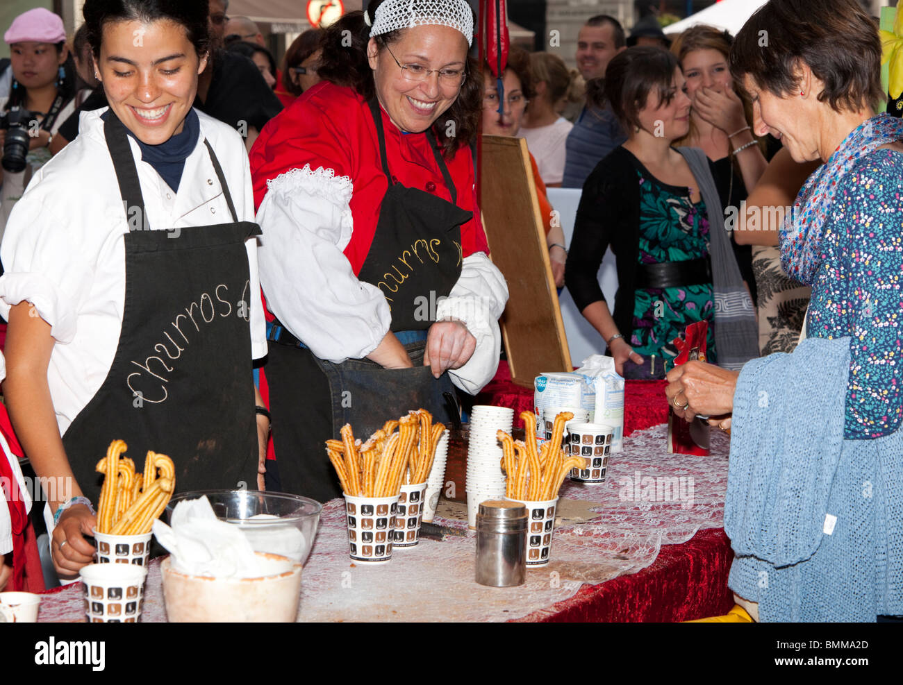 Portrait of Spanish churro vendors at a stall, London, UK Stock Photo ...