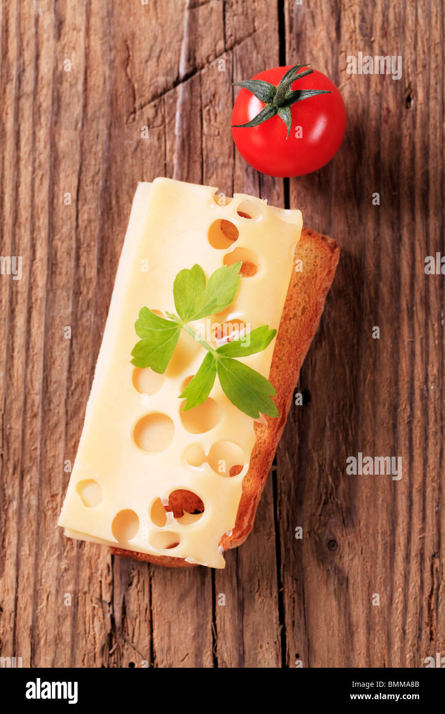 Slice of Swiss cheese on toast Stock Photo - Alamy