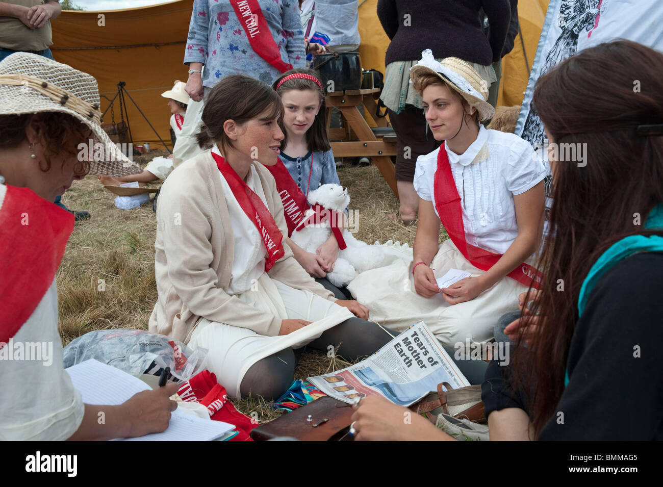 Climate Rush: Celebration of Community Resistance, Sipson. A group sits ...