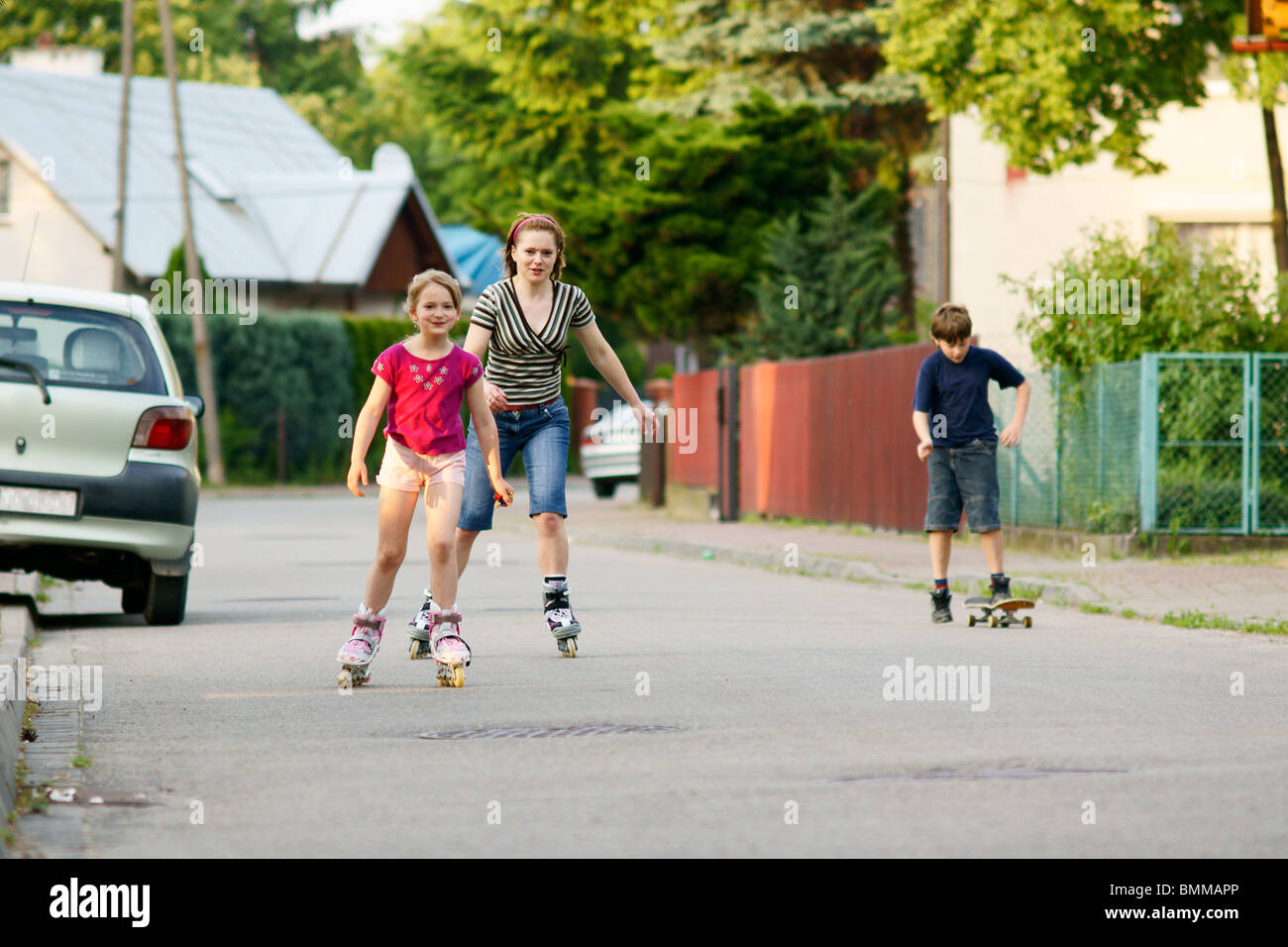 Mum skating with daughter Stock Photo - Alamy