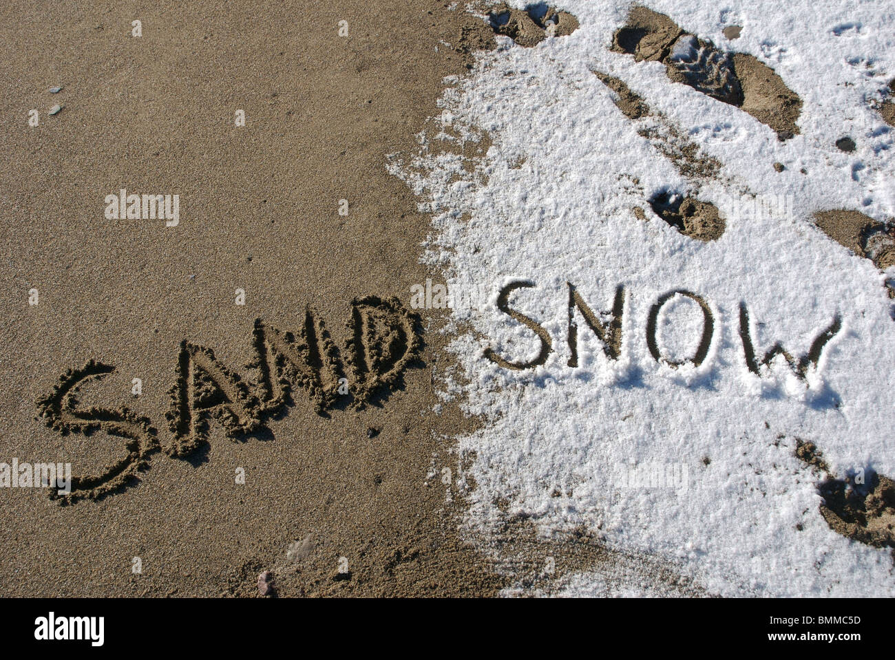 Sand and Snow words written in sand and snow on beach, Devon, UK Stock ...
