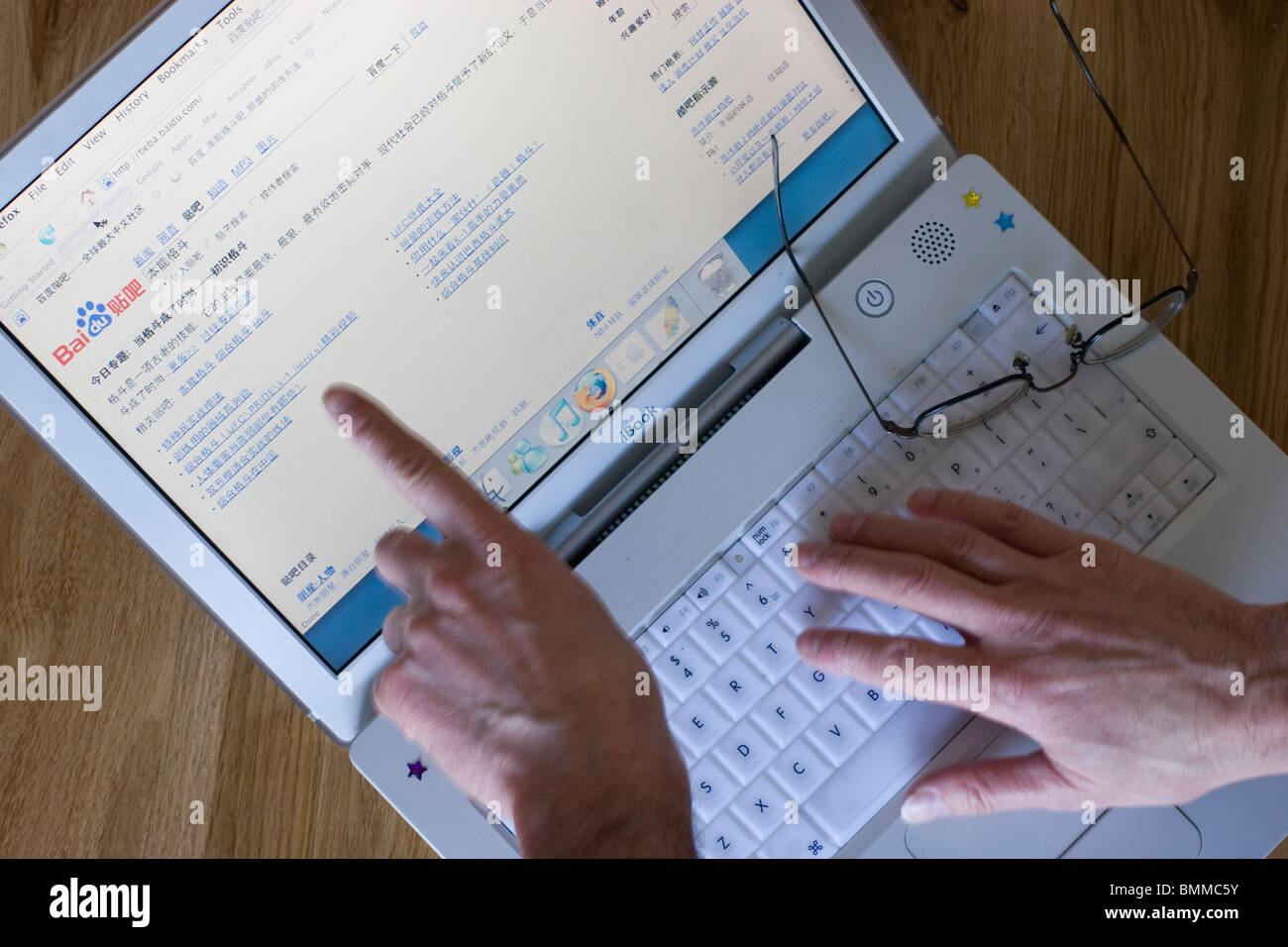 Person browsing the Chinese Baidu website on a laptop computer, with ...
