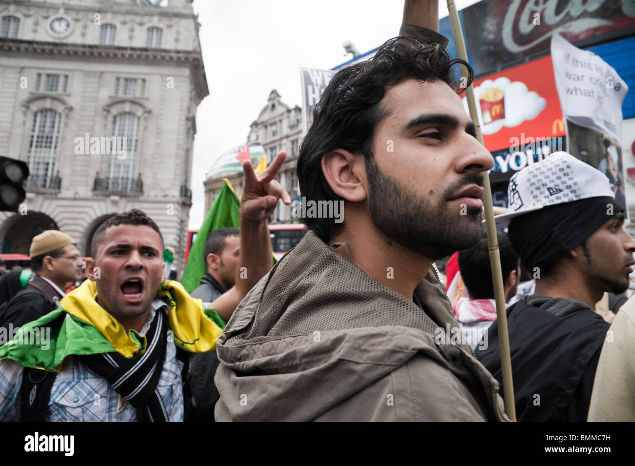 Angy male protesters pass right-wing counter demo at Piccadilly Circus ...