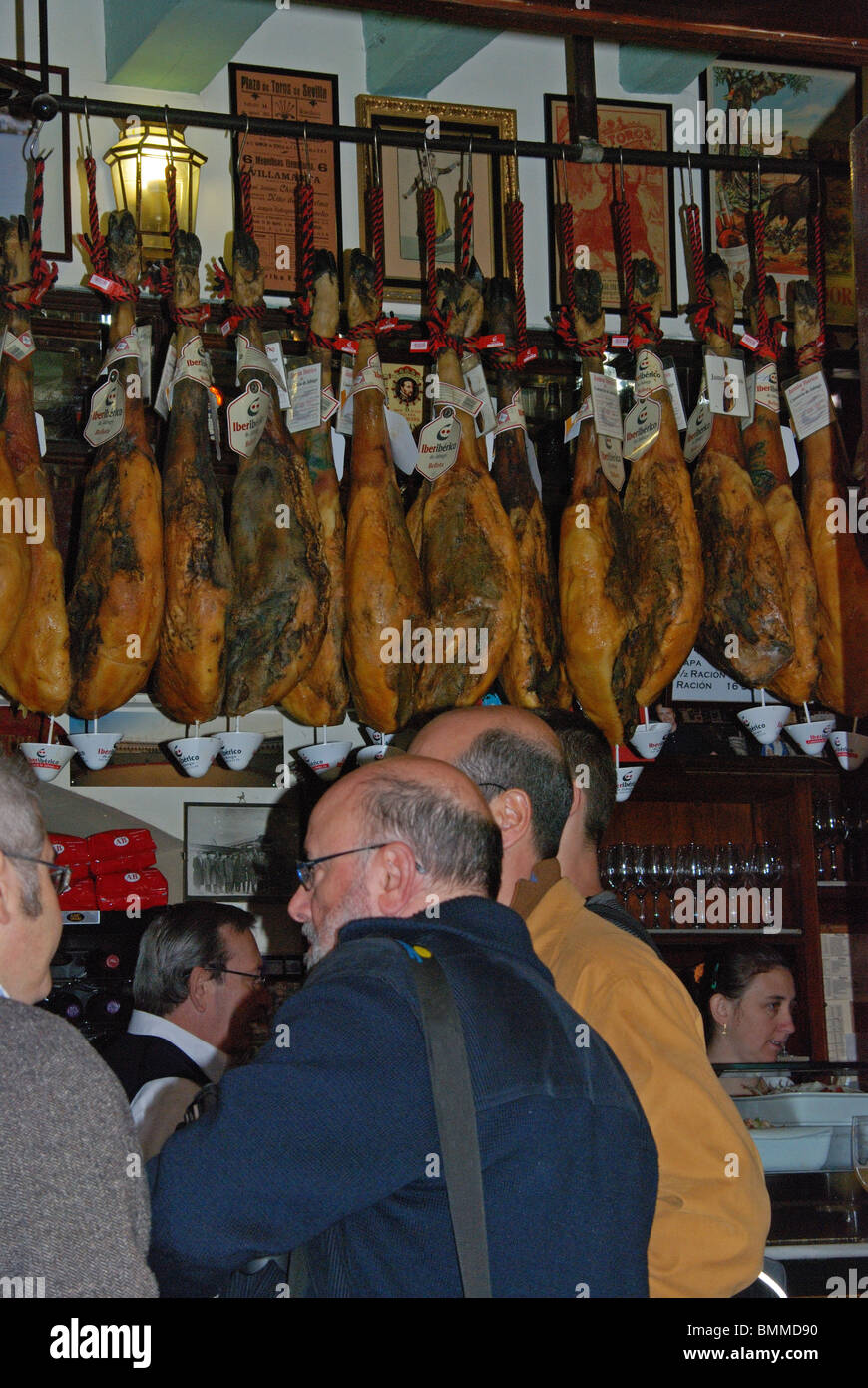 Serrano hams hanging in a Tapas bar, Santa Cruz District, Seville ...