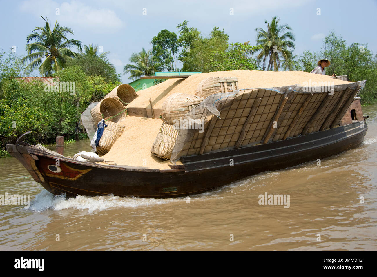 A fully laden rice barge on the Mekong River in Vietnam Stock Photo - Alamy