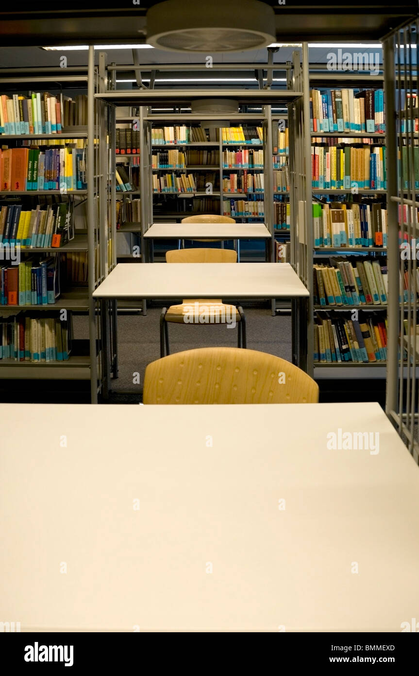 In perspective, horizontal, empty study desks and books shelving at the ...