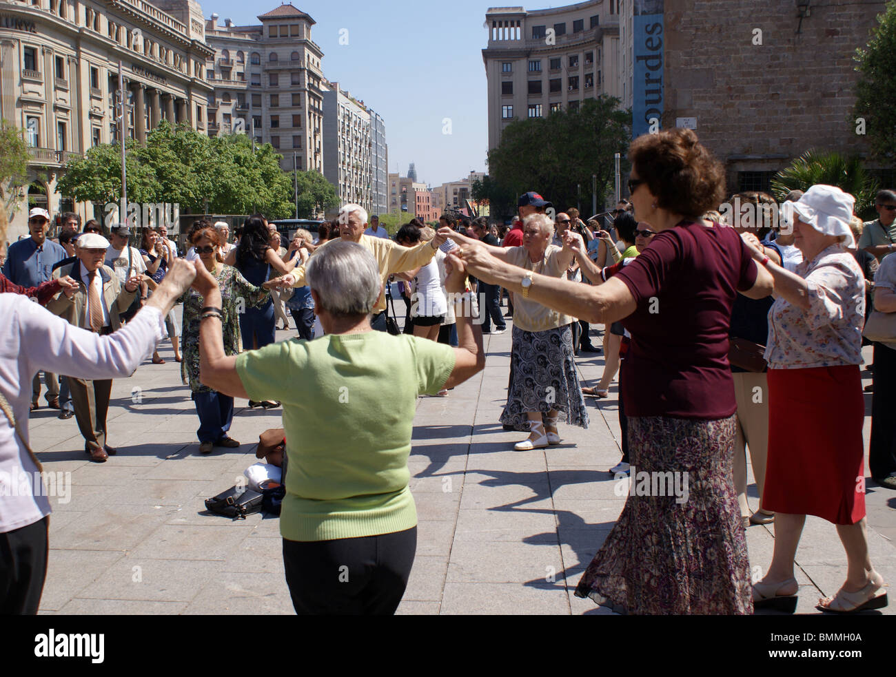 Spanish People dancing their traditional dance the Sardana outside the ...
