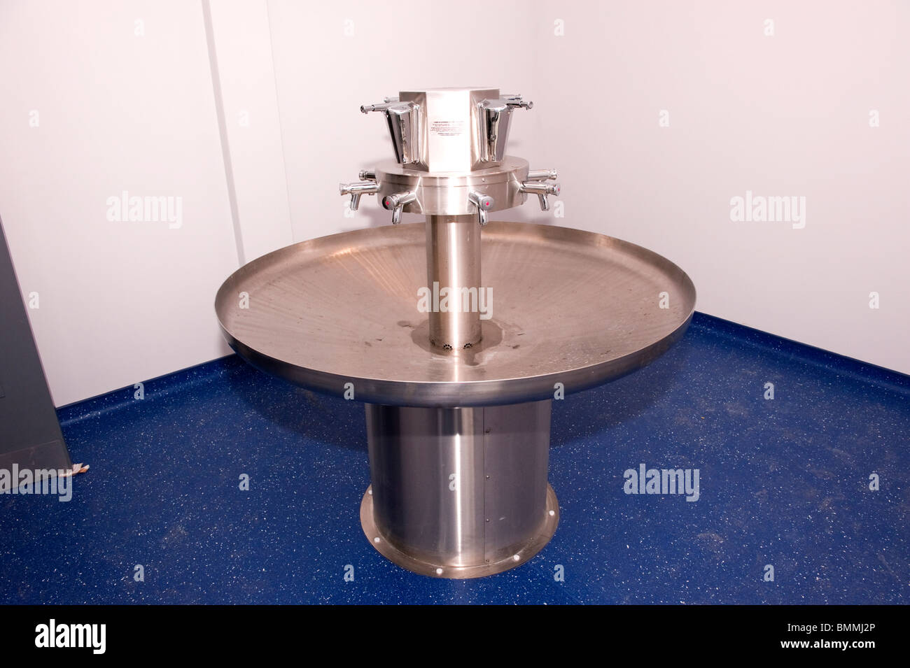 Stainless steel circular hand wash sink in factory Stock Photo - Alamy