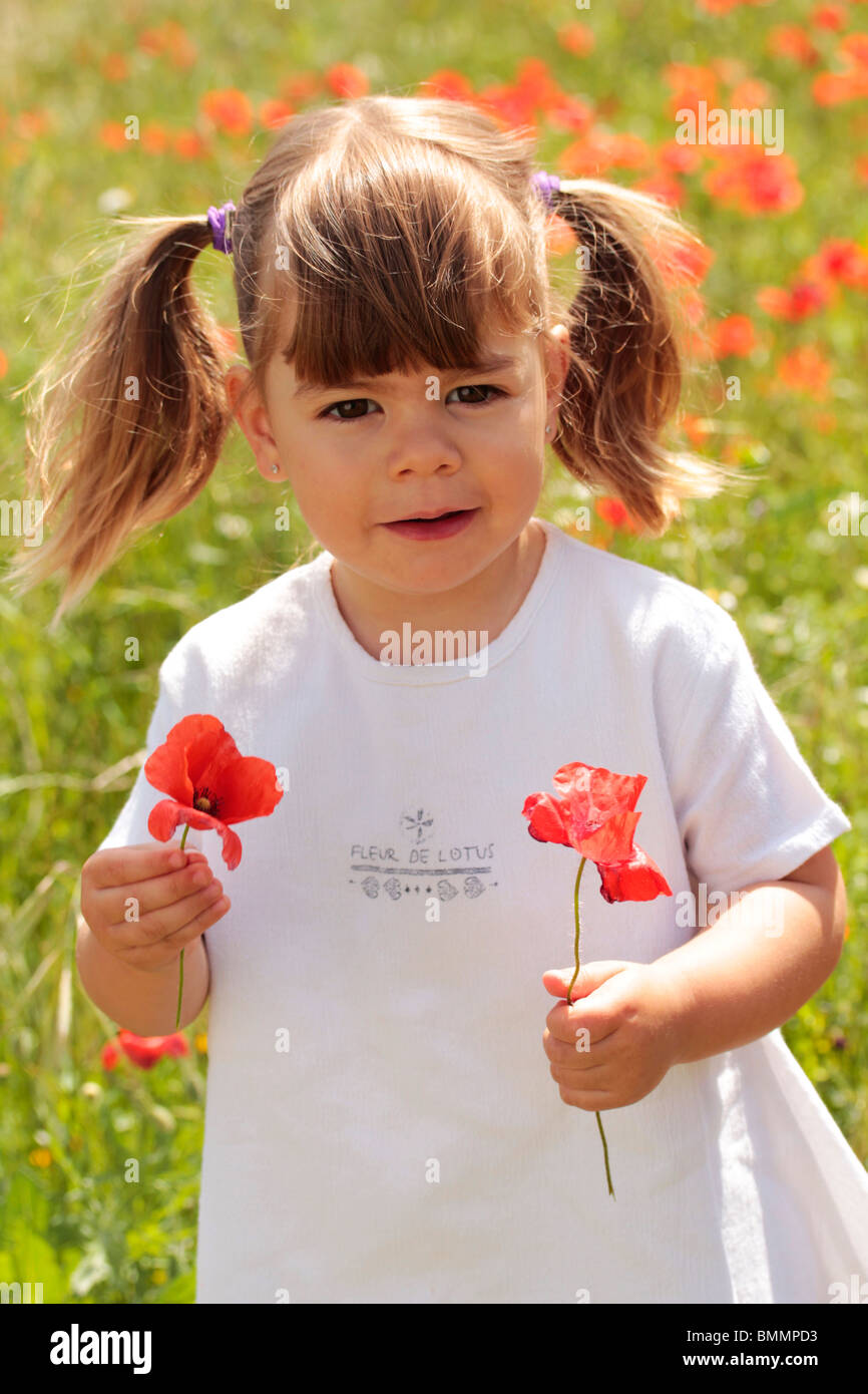 Little girl with poppies Stock Photo - Alamy