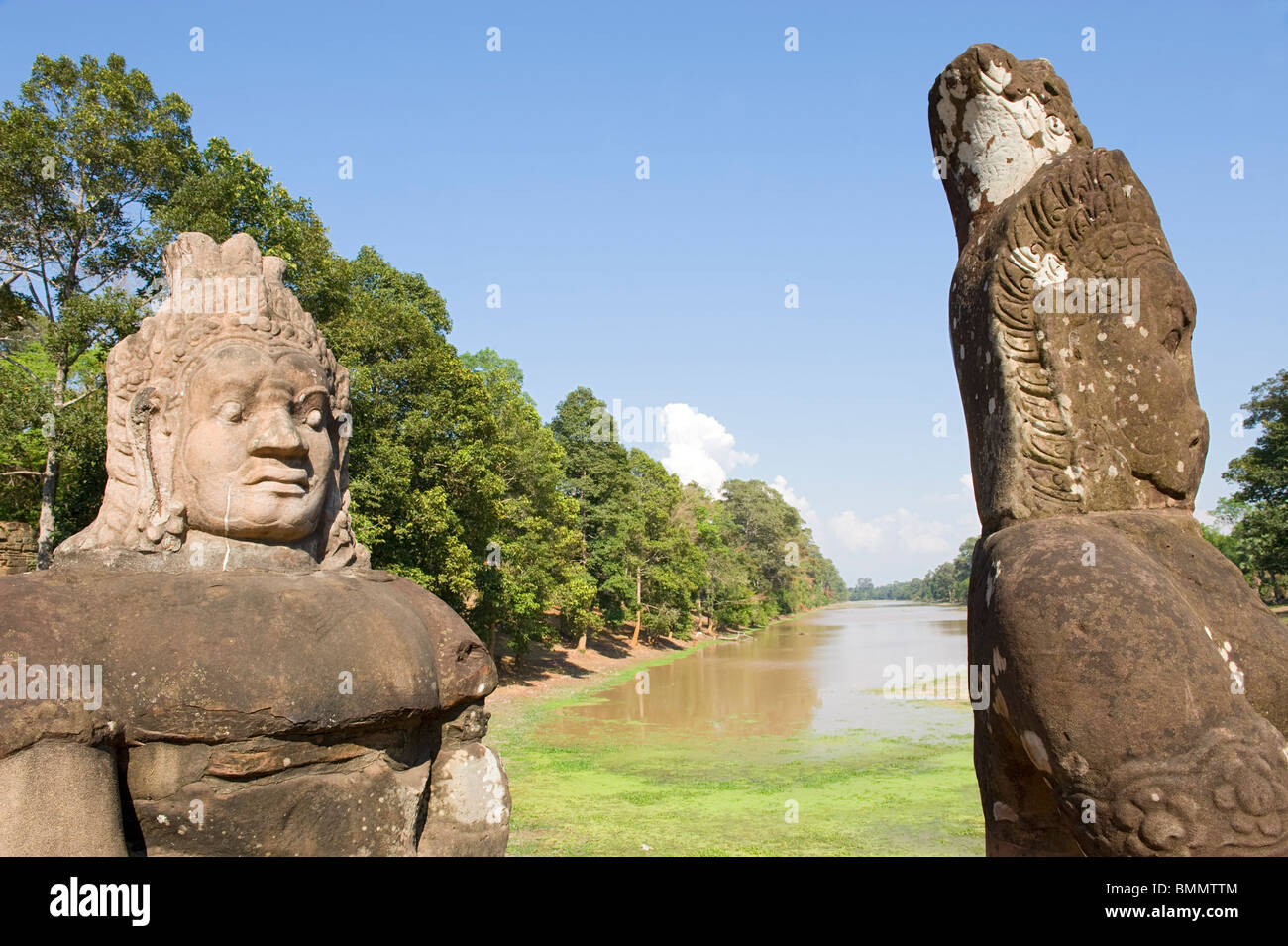 Two of the carved stone warrior gods along the bridge over the moat ...