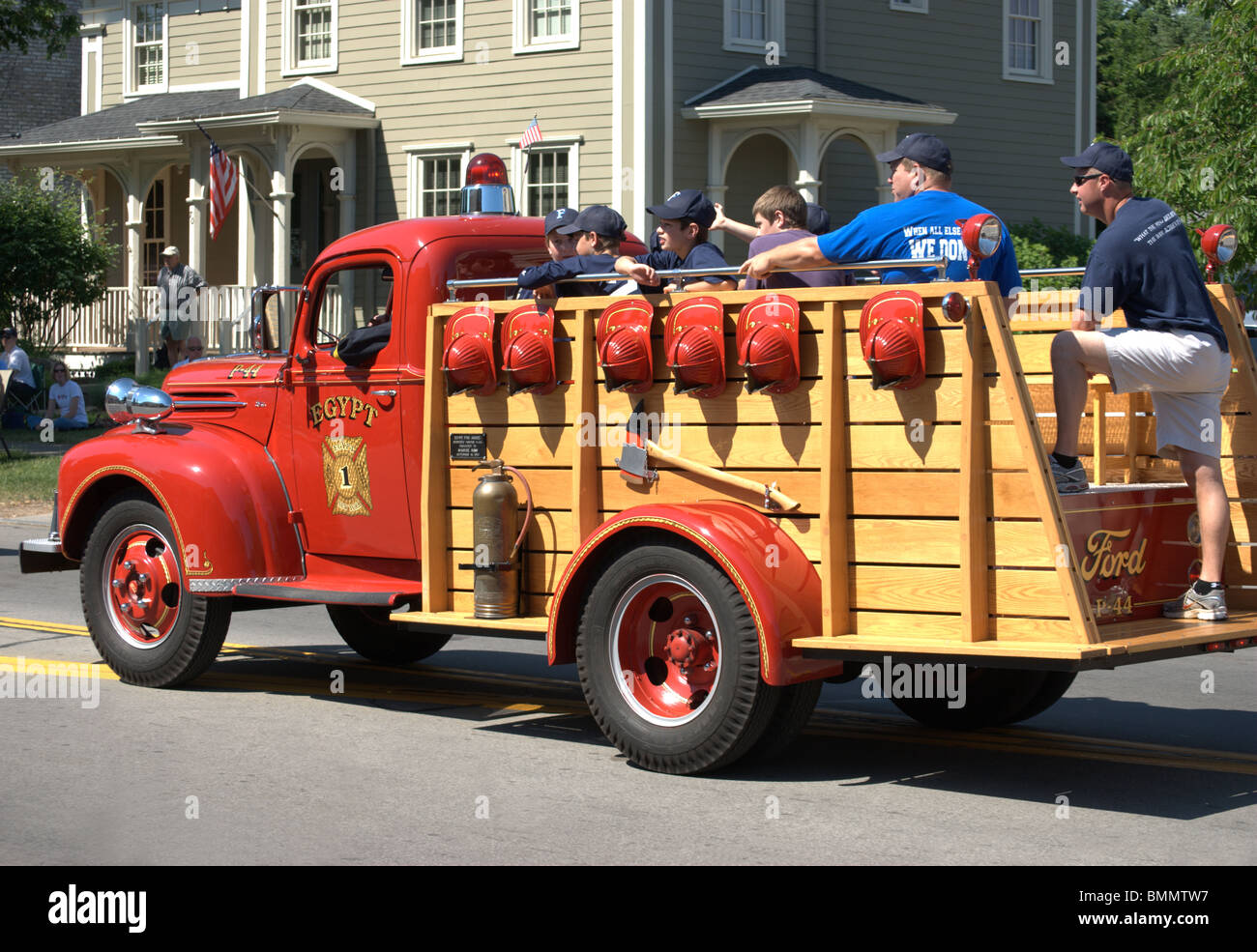 Vintage fire engine with local boys team in Memorial Day parade Stock ...