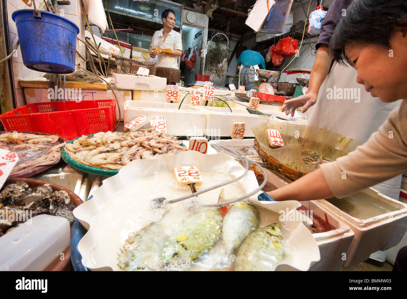 Fishes and Seafood on display in shop in fish market in Hong Kong Stock ...