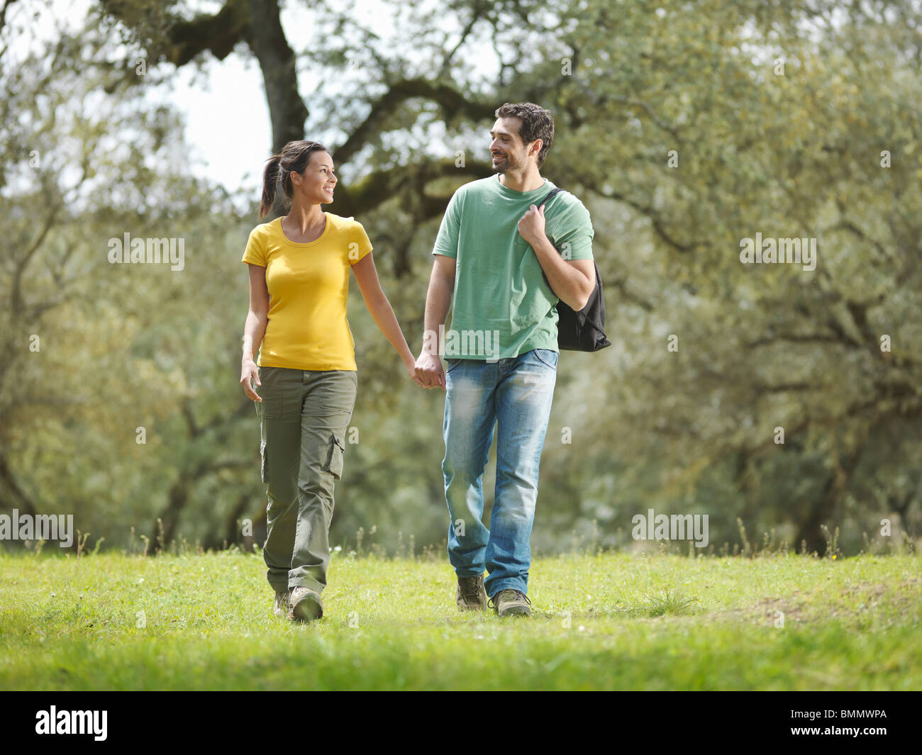 Two people walking hand in hand hi-res stock photography and images - Alamy