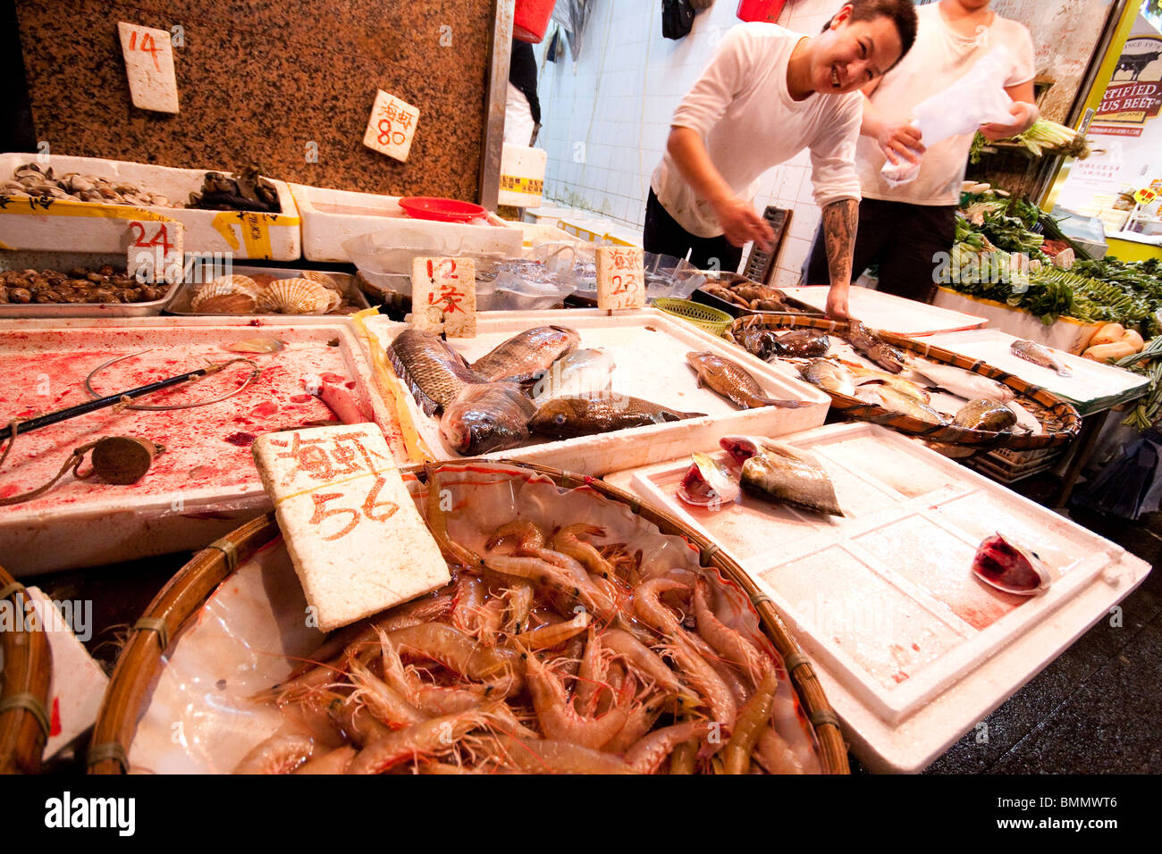 Seafood and fishes for sale in store at a local fish market in Wan Chai ...