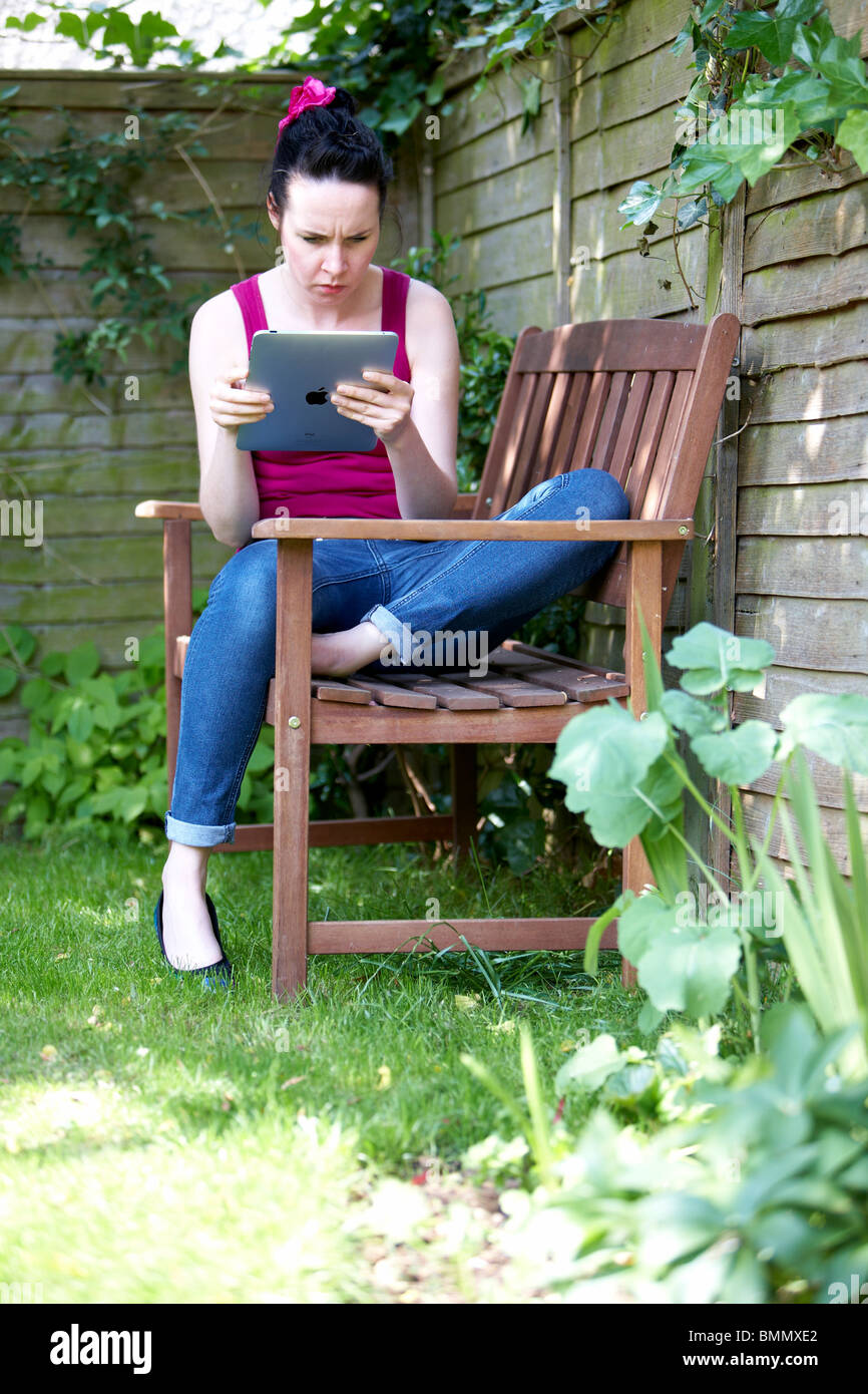 Woman garden ipad hi-res stock photography and images - Alamy