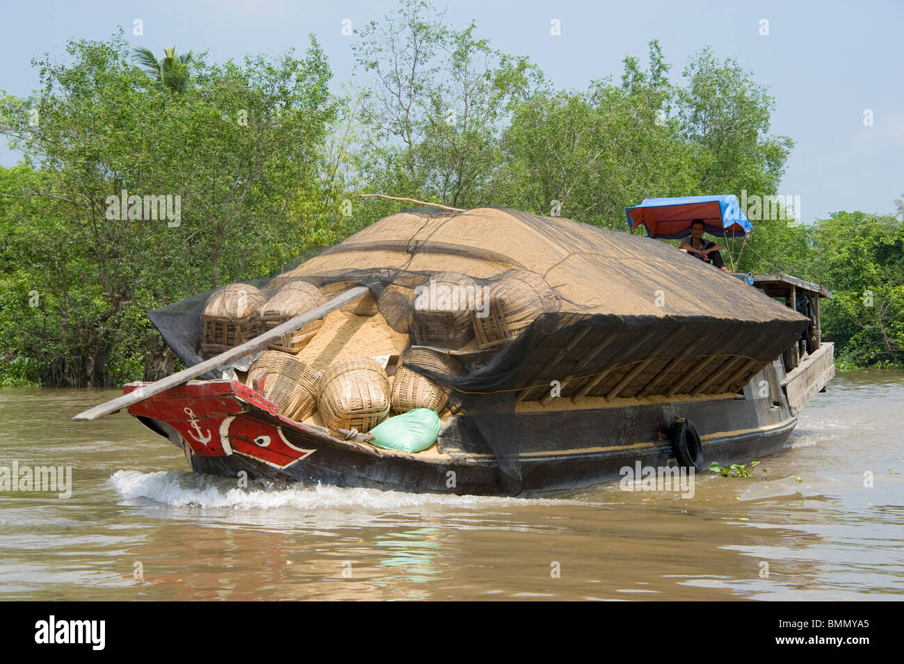A fully loaded rice barge on the Mekong River in Vietnam Stock Photo ...