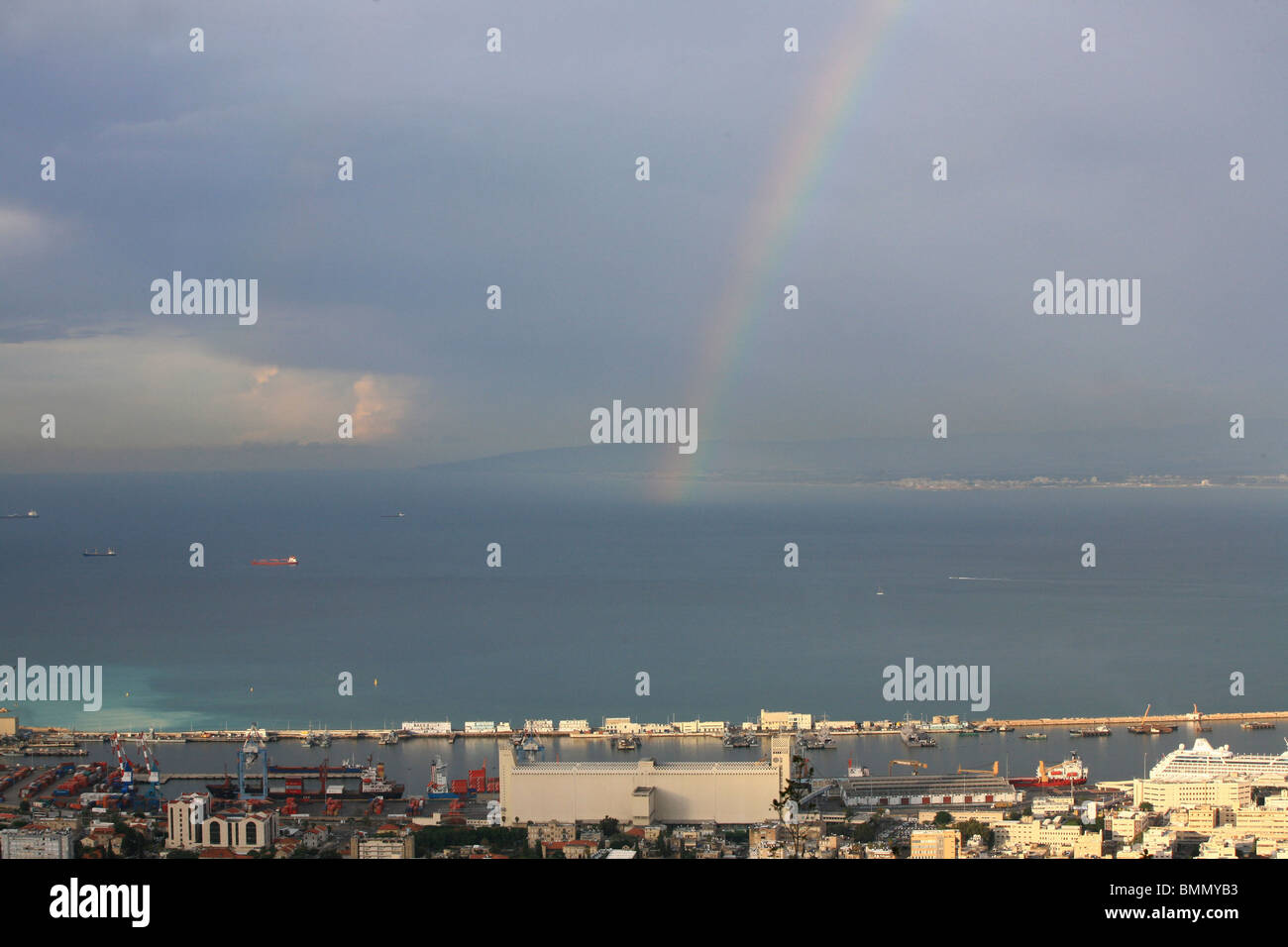 Israel, Haifa. View of Haifa port, Haifa bay and downtown. Rainbow over ...
