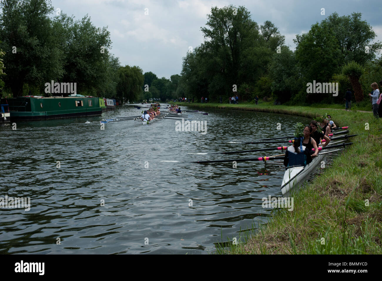 Crews that have bumped another boat wear greenery as they row home ...