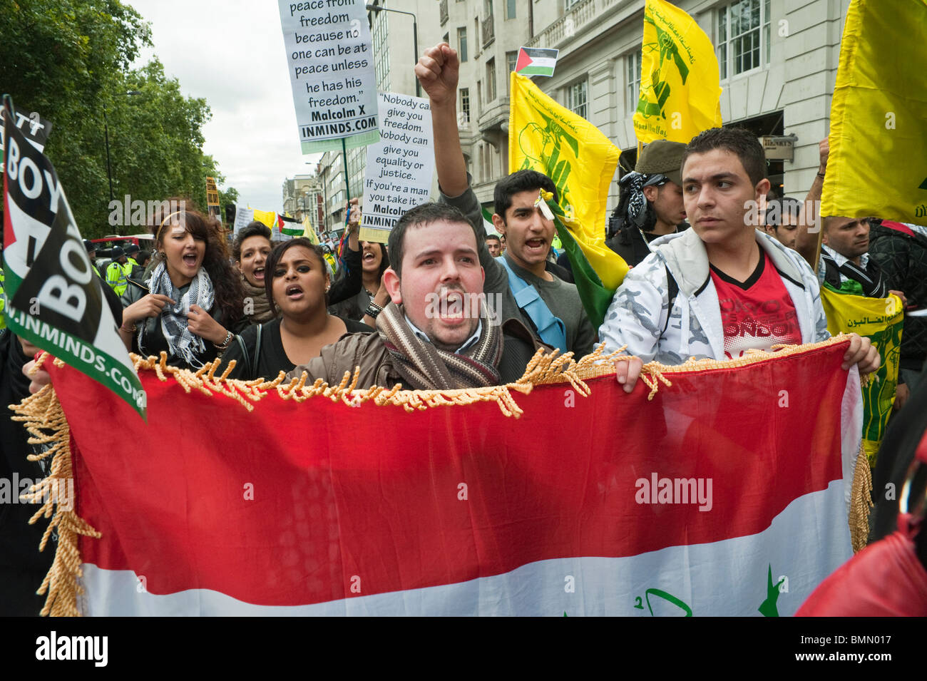 Marchers crowd behind banner at Al Quds Day (Jerusalem Day) march in ...