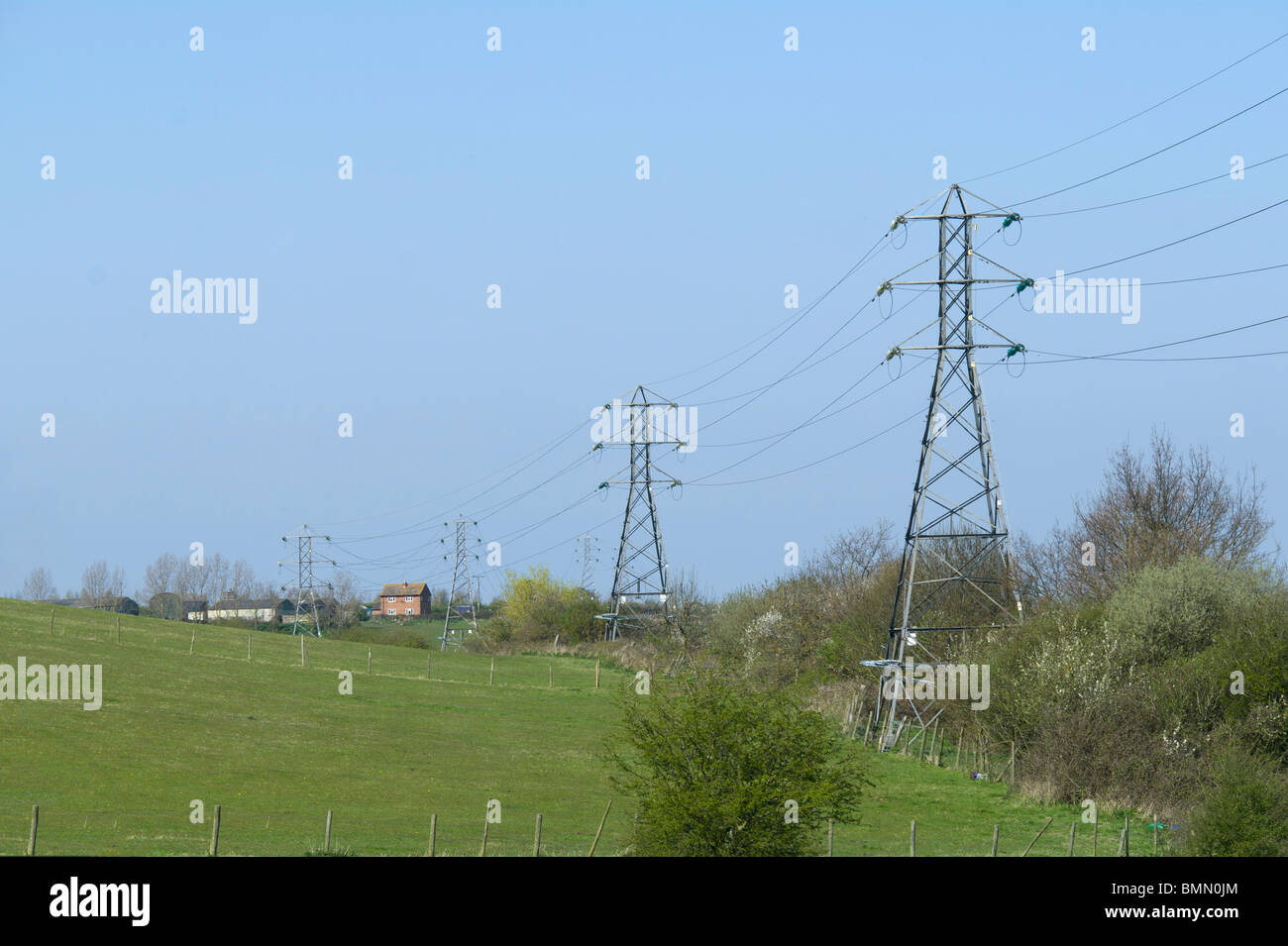 metal pylon carrying electricity supply power lines Stock Photo - Alamy