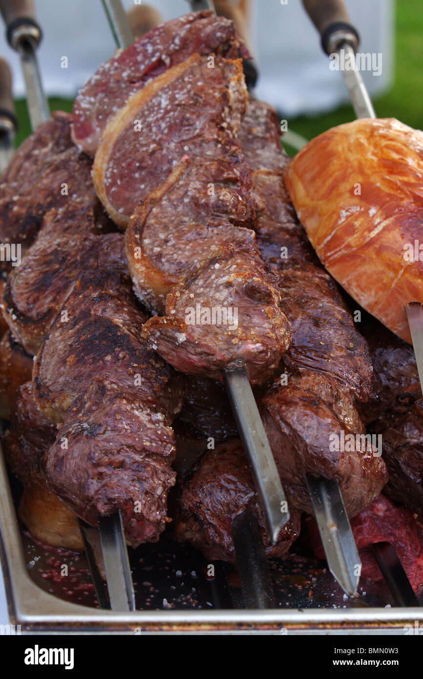 "chunks of beef meat threaded on sword for Churrasco grilled Stock ...