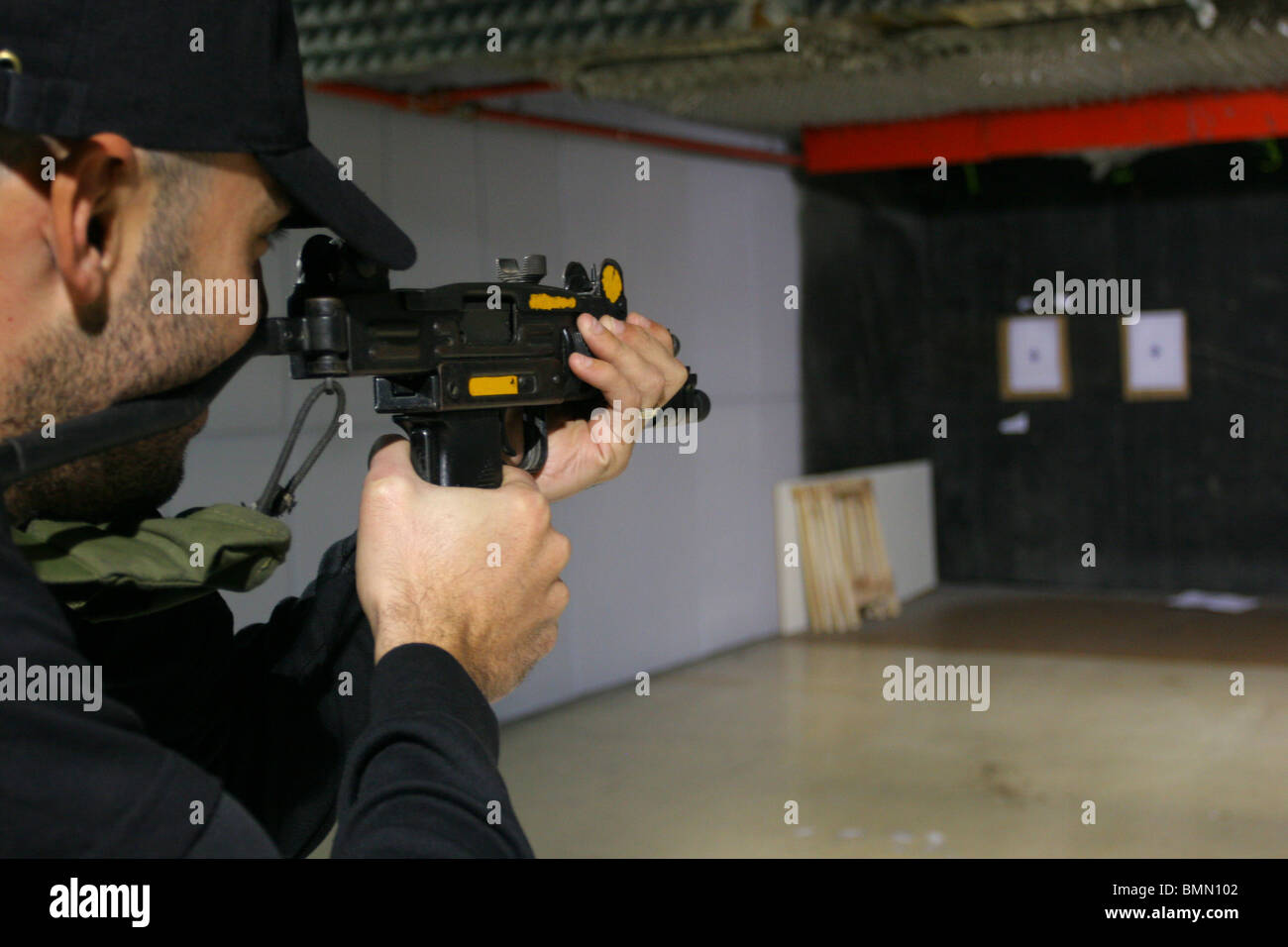 Man in a firing range practice Stock Photo - Alamy