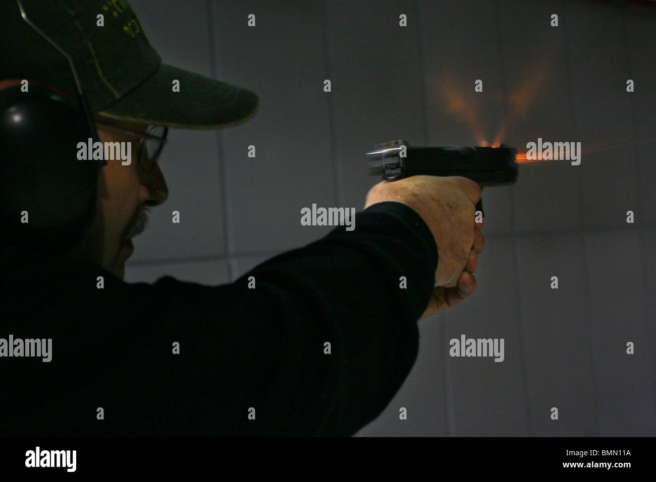 Man in a firing range practice Stock Photo - Alamy