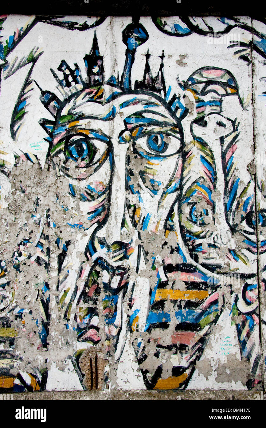Two graffiti heads painted on a section of the Berlin Wall Berlin ...