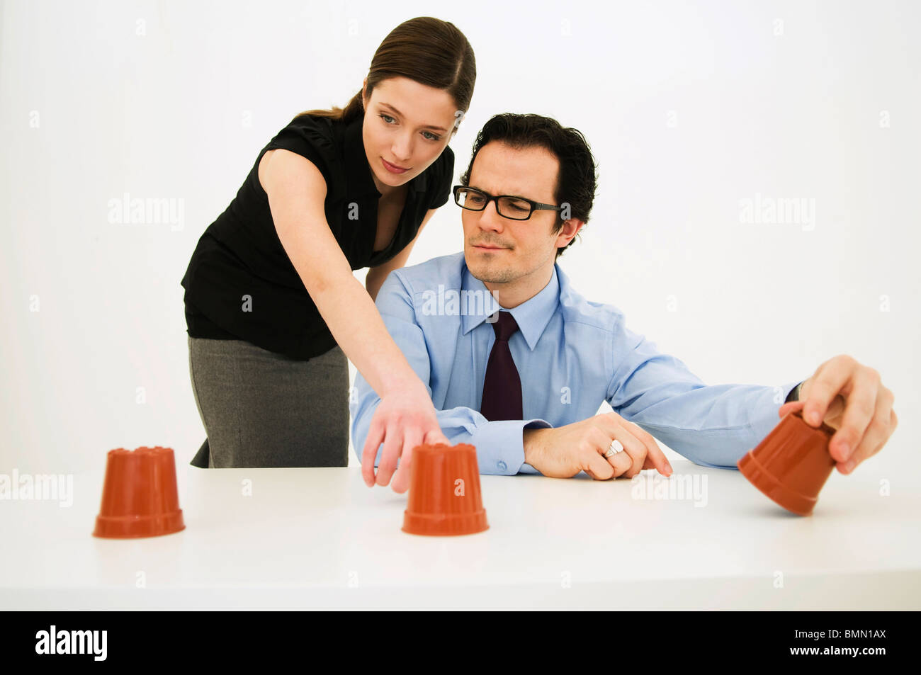 Couple looking for hidden item Stock Photo - Alamy