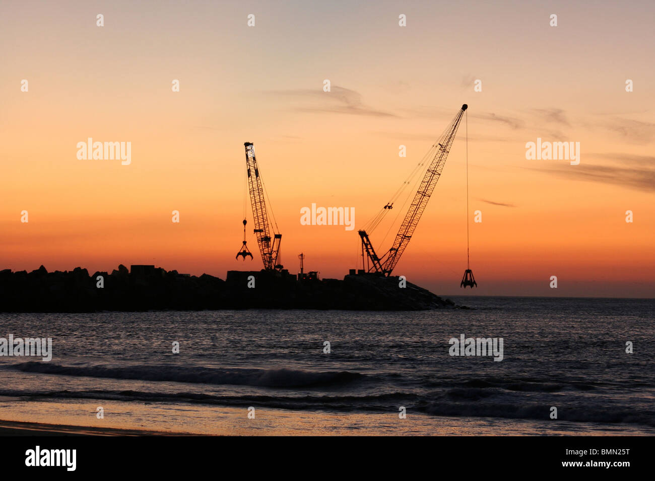 Cranes working on the sea Stock Photo - Alamy