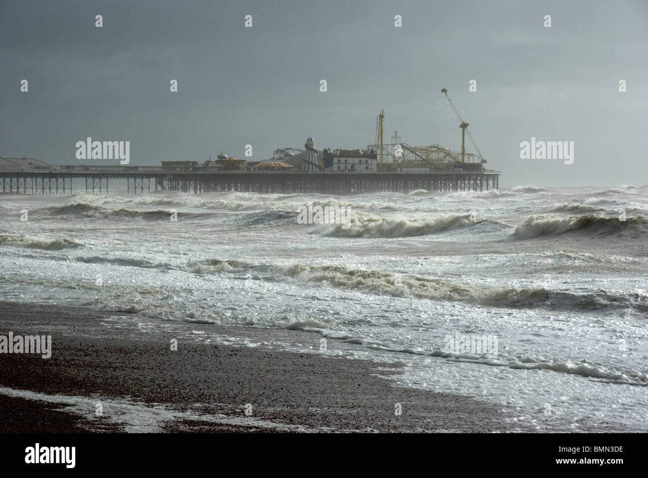 Brighton Wave On Beach With Palace Pier Stock Photo - Alamy