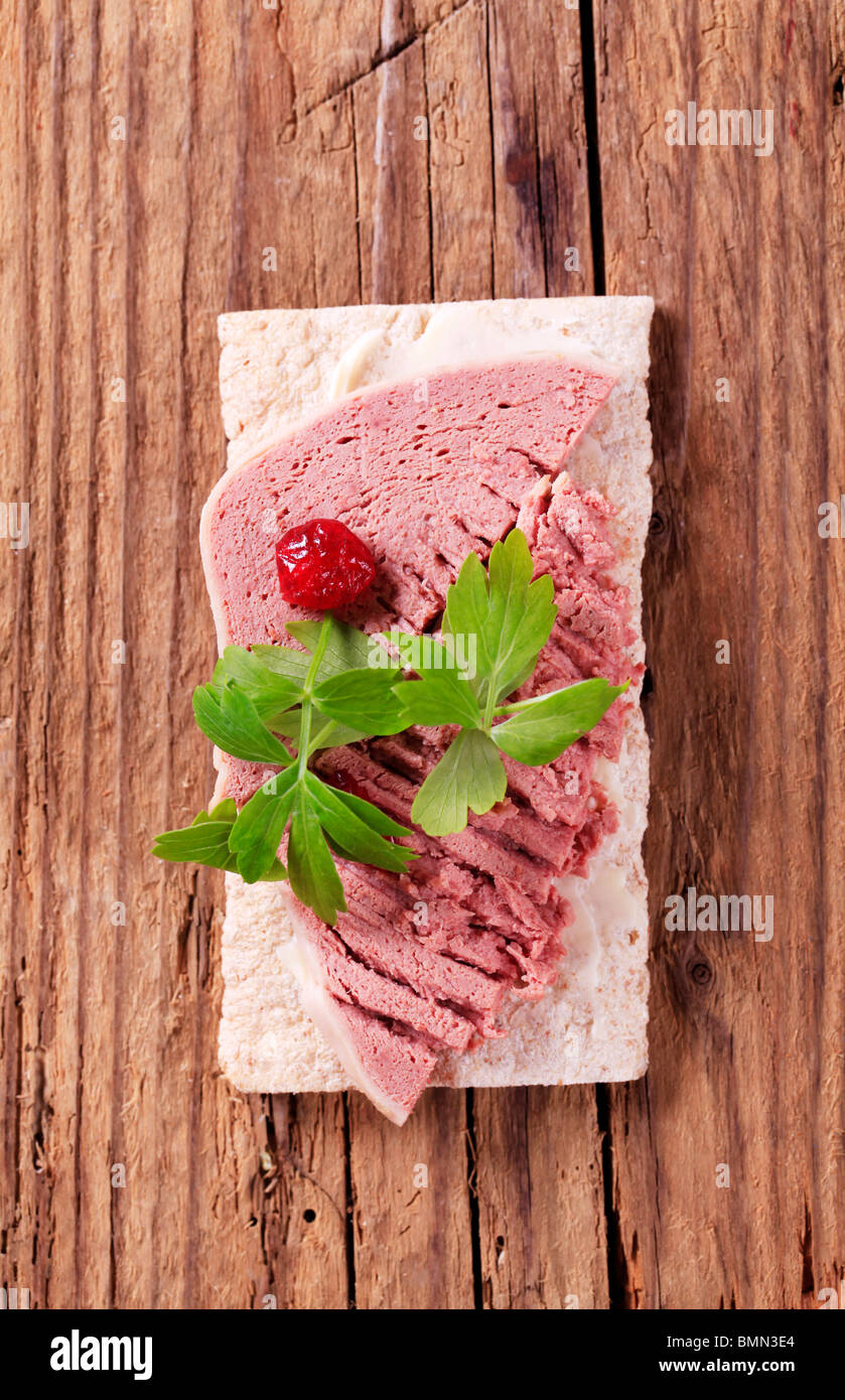 Cracker and liver pate - overhead Stock Photo - Alamy