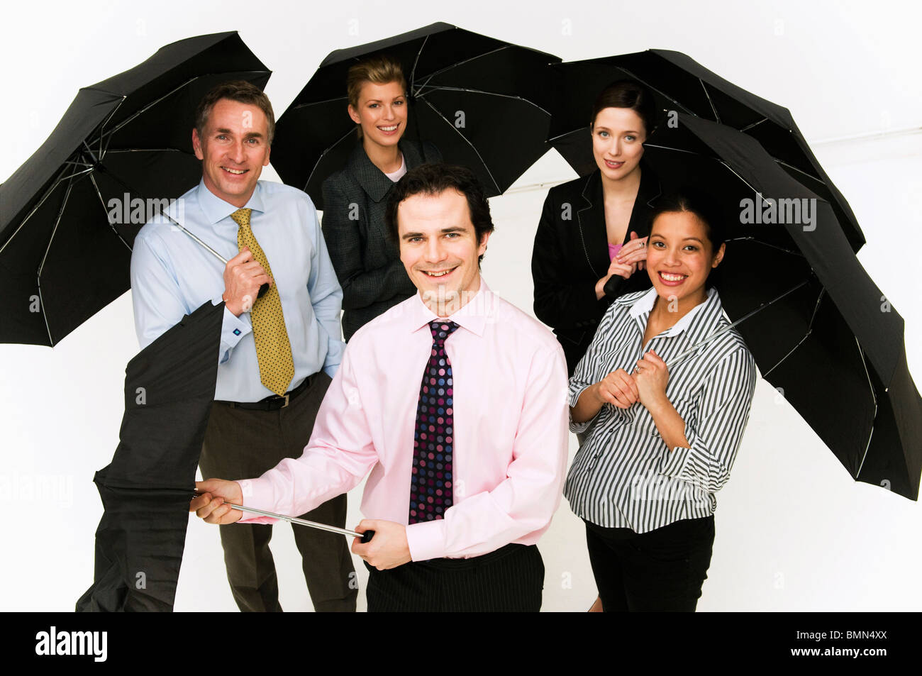 Group of business people with umbrellas Stock Photo - Alamy