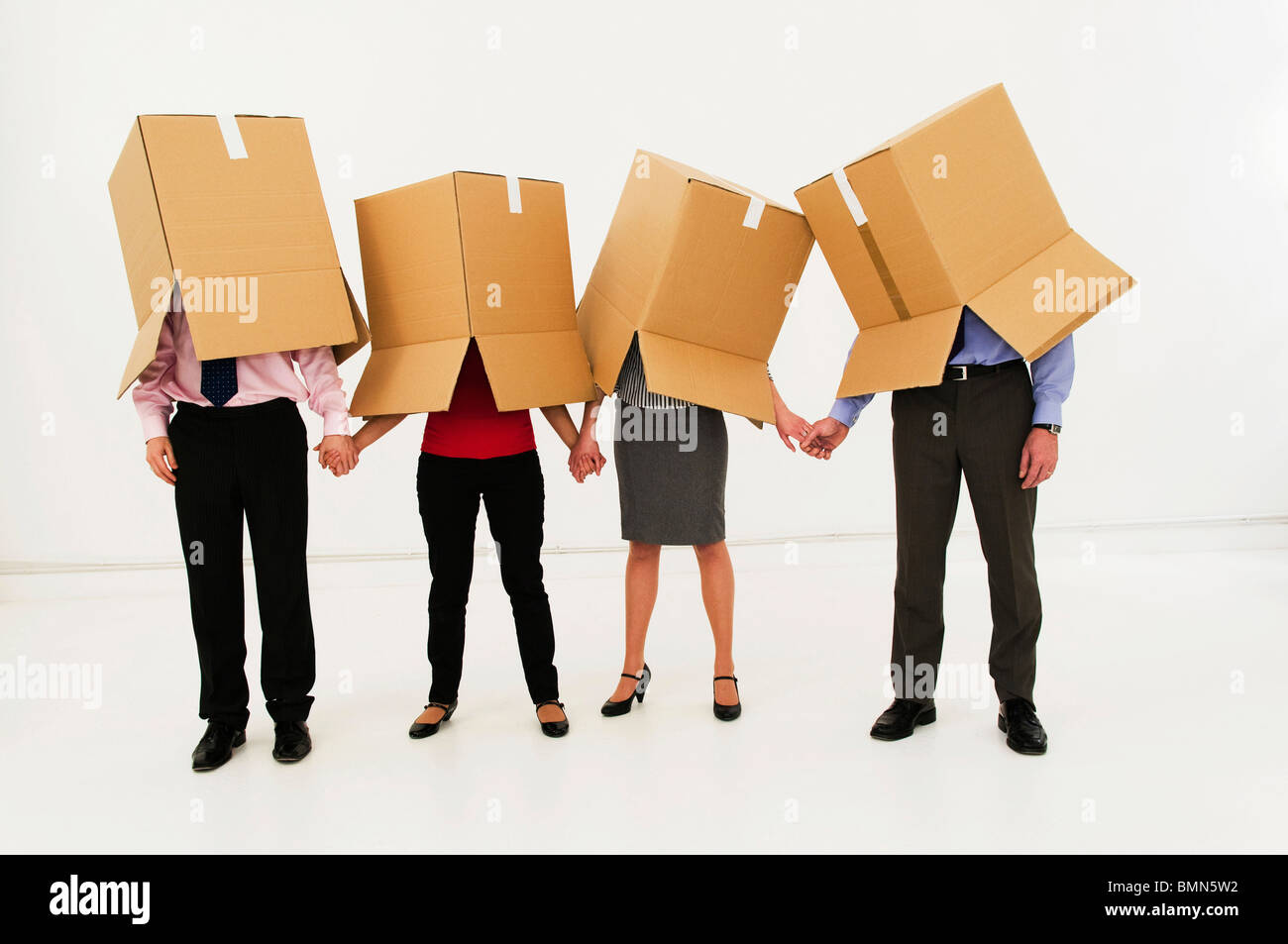 Four workers united in too much work Stock Photo - Alamy