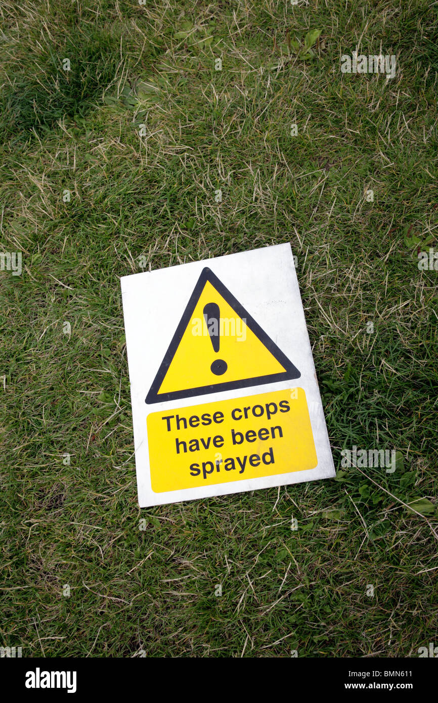 These Crops Have Been Sprayed Sign in Grass Stock Photo - Alamy