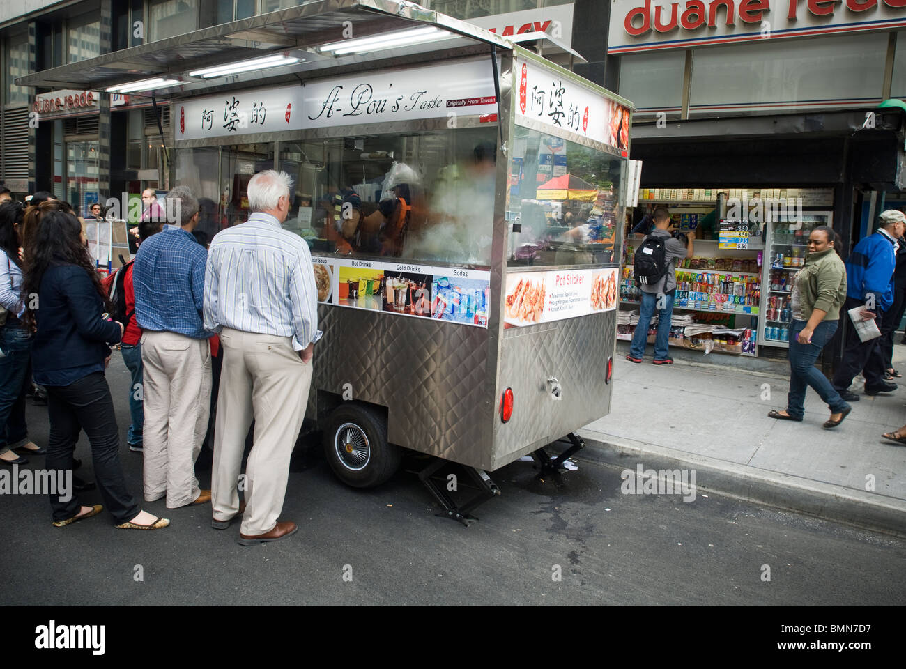 Diners line up for at the A-Pou's Taste food cart to lunch on Taiwanese ...
