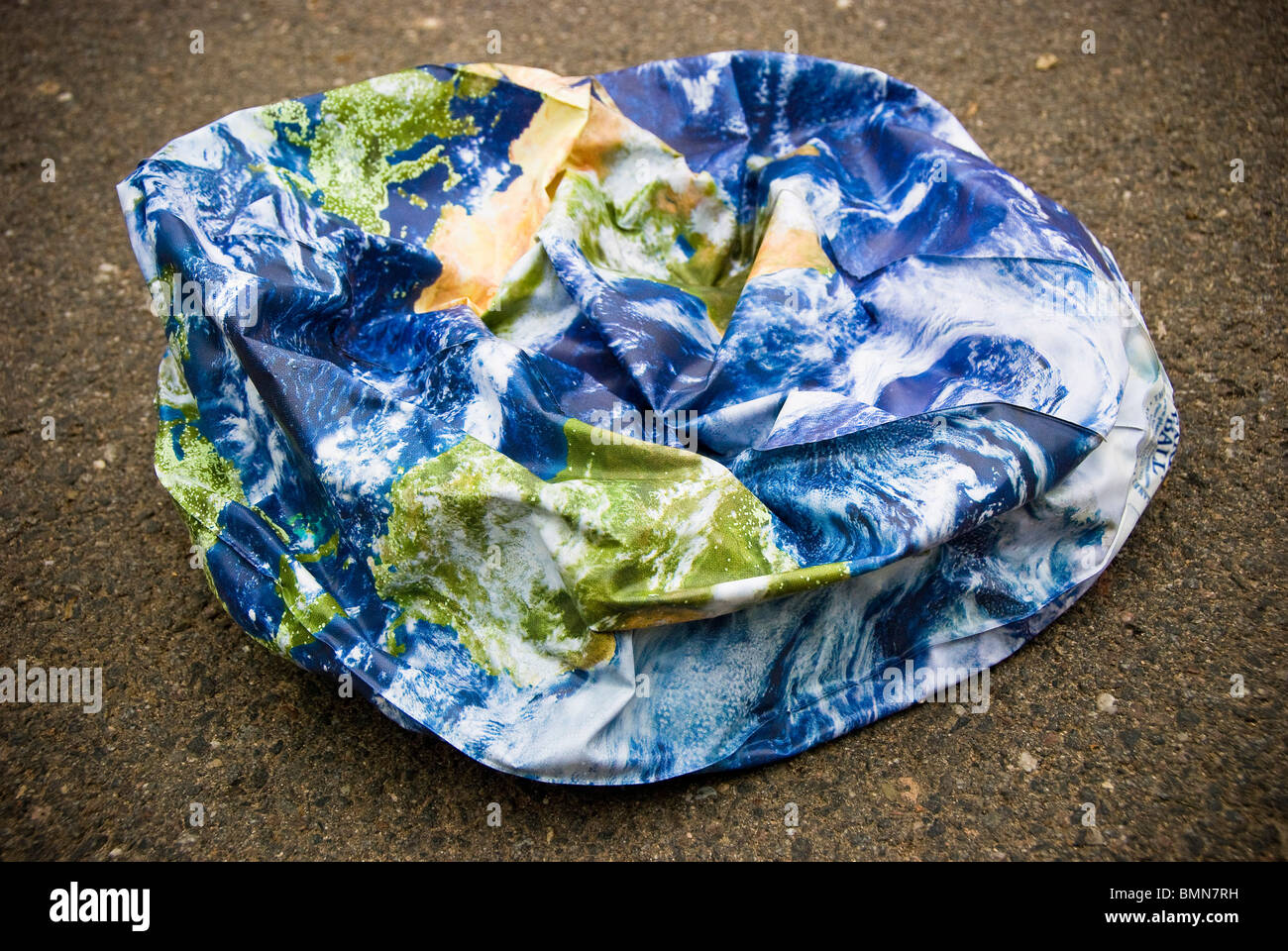 a deflated earth globe, ecology and global warming concept Stock Photo ...