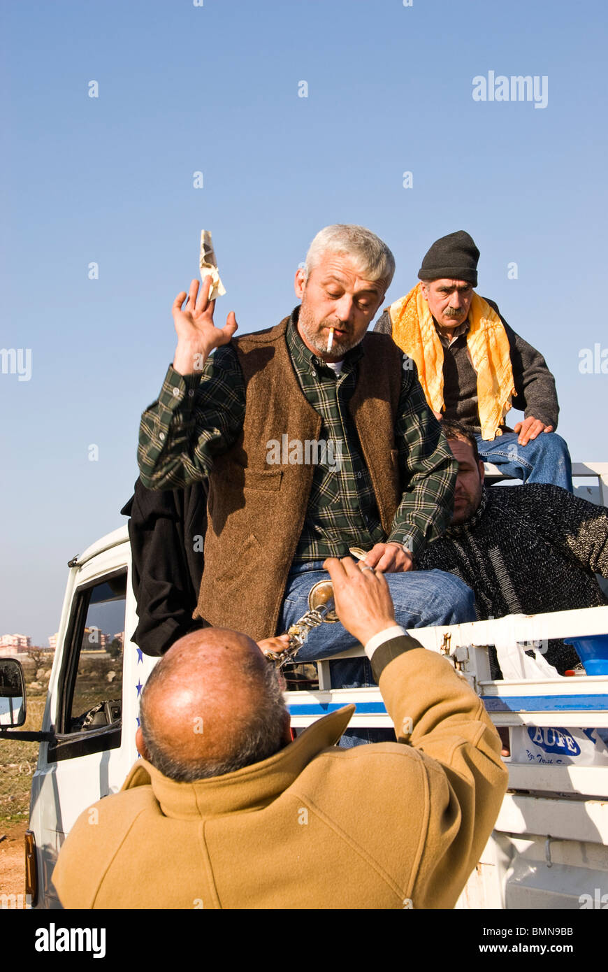Gipsies playing music during the camel figths in Ayvalik, Turkey, Asia ...