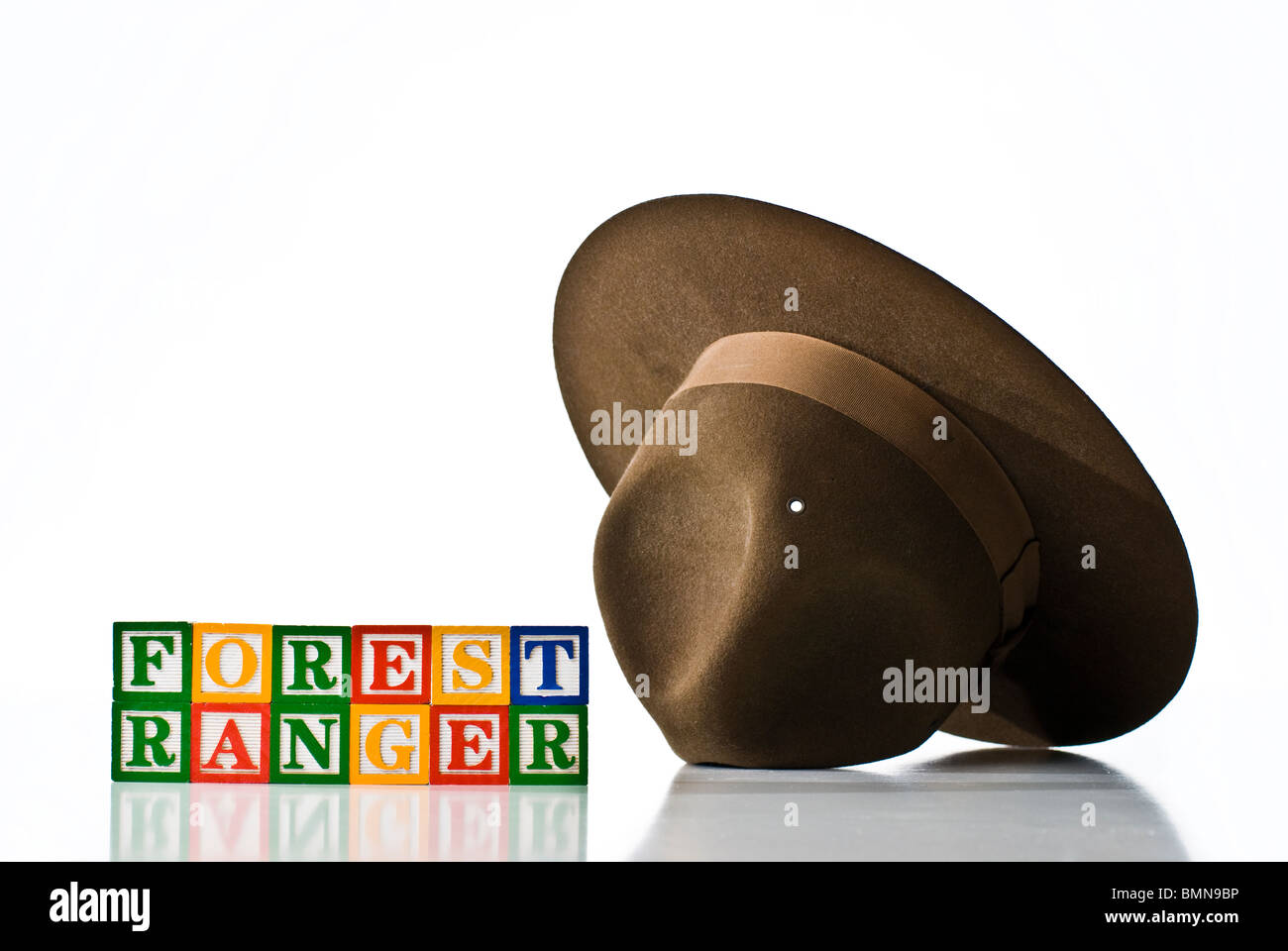 Colorful children's blocks spelling FOREST RANGER with a ranger hat ...