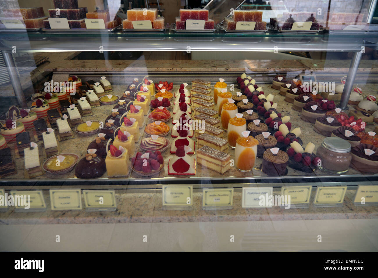 Pastries and cakes displayed in the window of a French Patisserie Stock ...