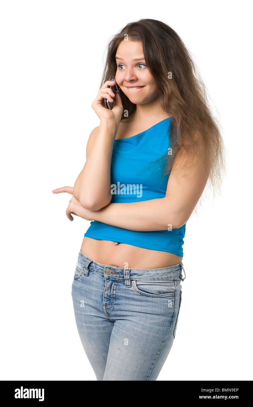 laughing girl bite one's lip and talking on the phone, isolated on ...