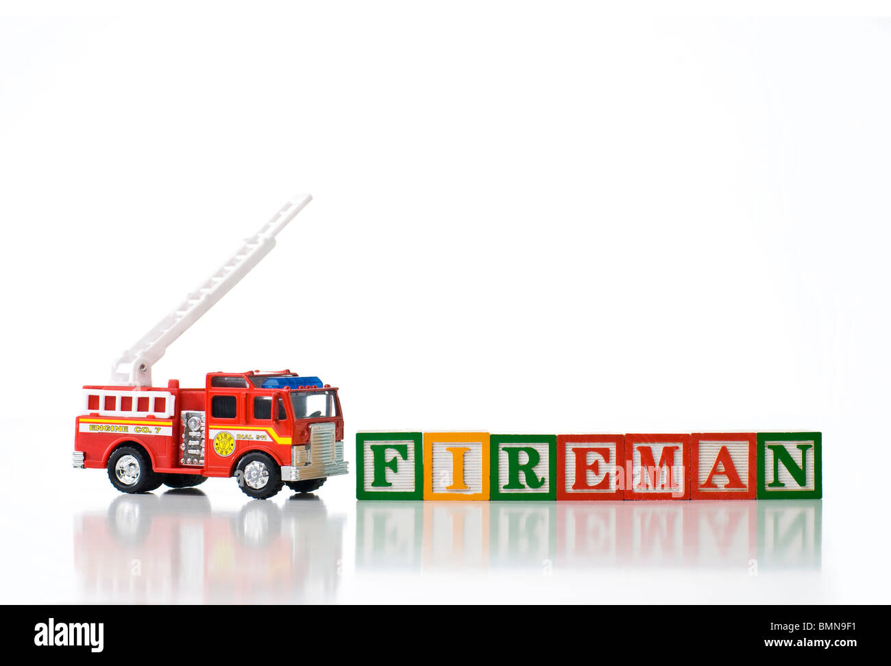 Colorful children's blocks spelling FIREMAN with a fire truck Stock ...