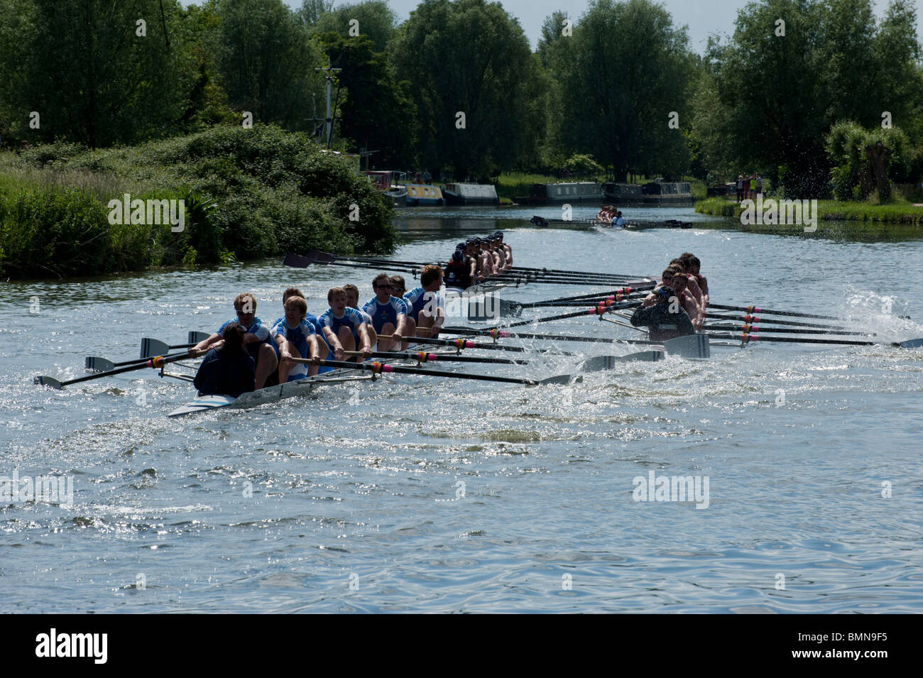 Three racing boats vie for blades on the Cam during May Bumps in ...