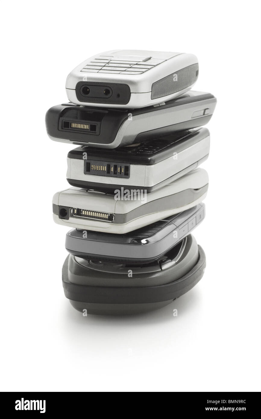 Stack of assorted cellphones on white background Stock Photo - Alamy
