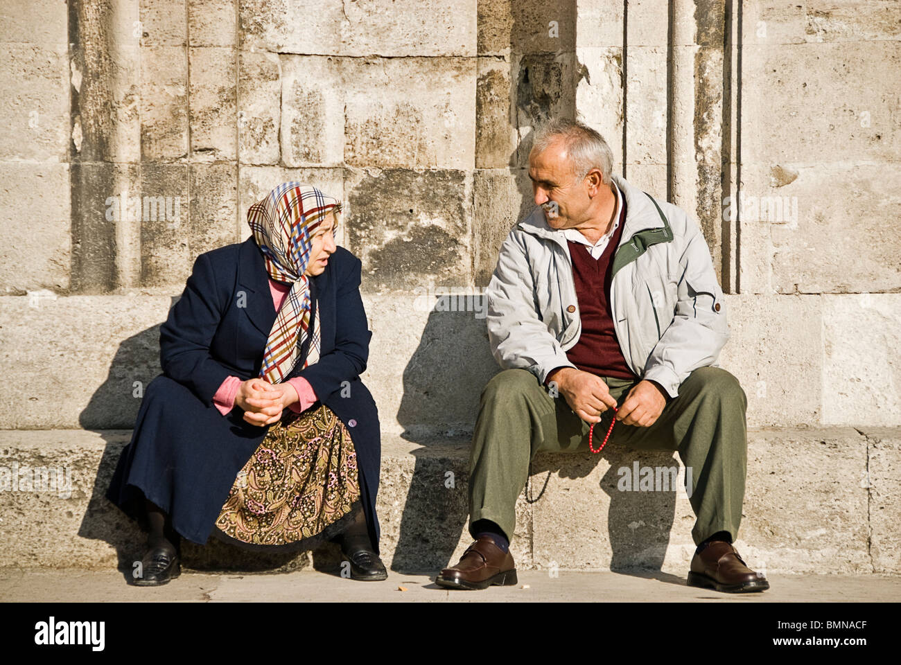 Muslim people talking outside a mosque, Istambul, Turkey,Europe, Asia ...