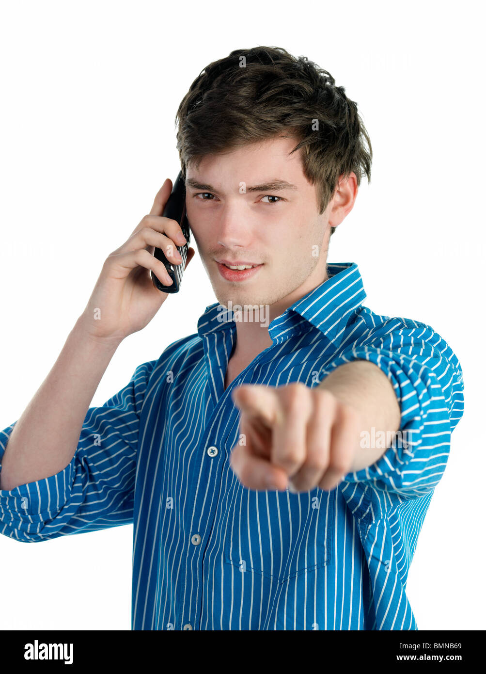 Young serious man pointing, isolated on white background Stock Photo ...