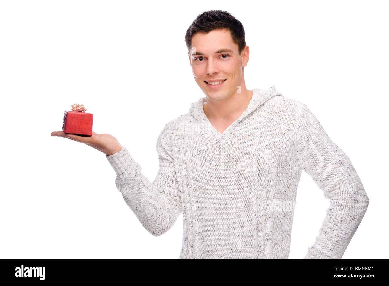 Full isolated studio picture from a young man with small present Stock ...