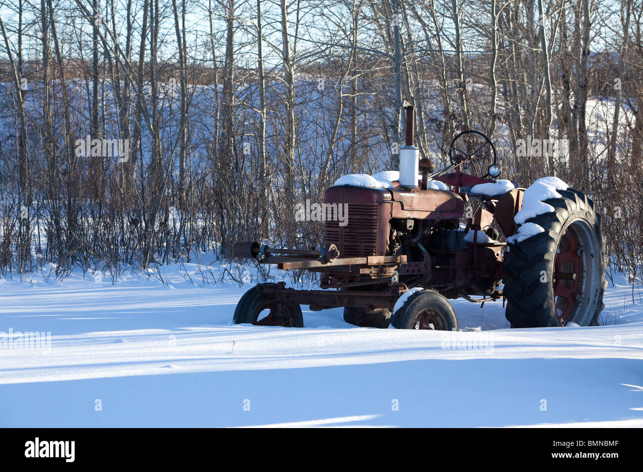 Old Tractor In The Snow Stock Photo - Alamy