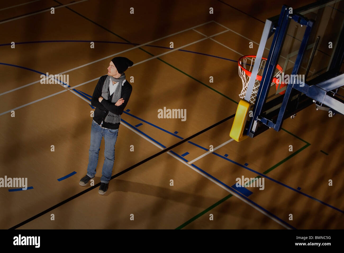 Man Standing In Basketball Court Stock Photo - Alamy