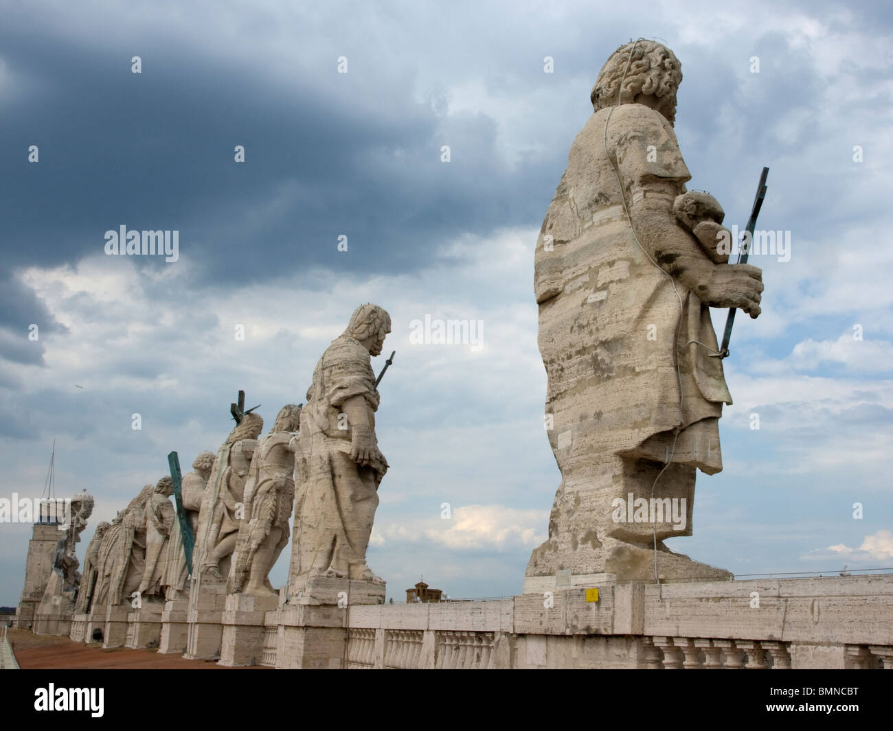 Statues of saints on the roof of St Peter's Cathedral in Rome with a ...